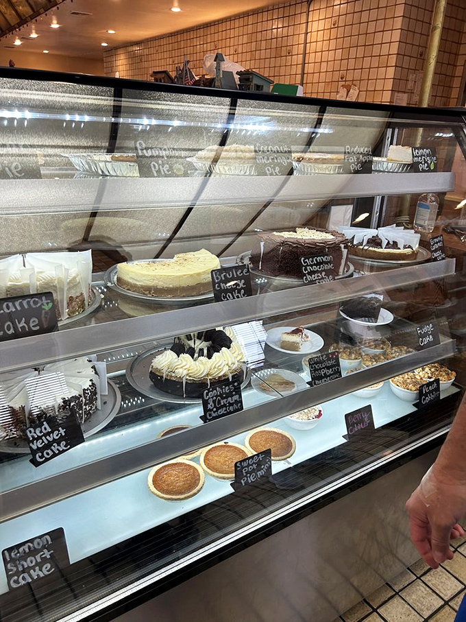 The dessert case &ndash; where willpower goes to die. Each handwritten label promises a different path to sweet satisfaction.