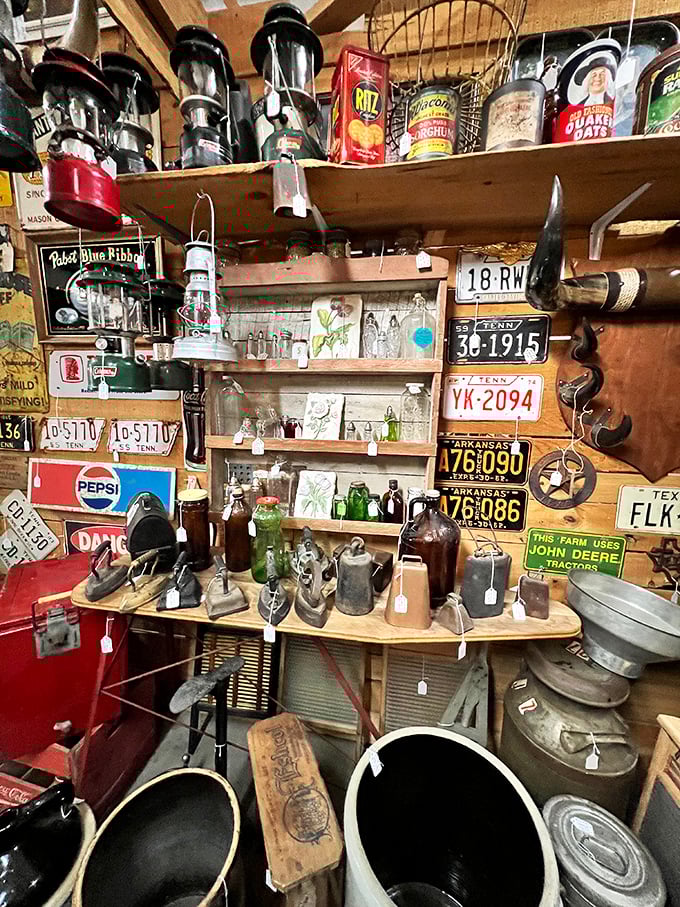 Vintage Americana at its finest. License plates, lanterns, and memorabilia create a time-traveling corner that's pure roadside attraction magic.