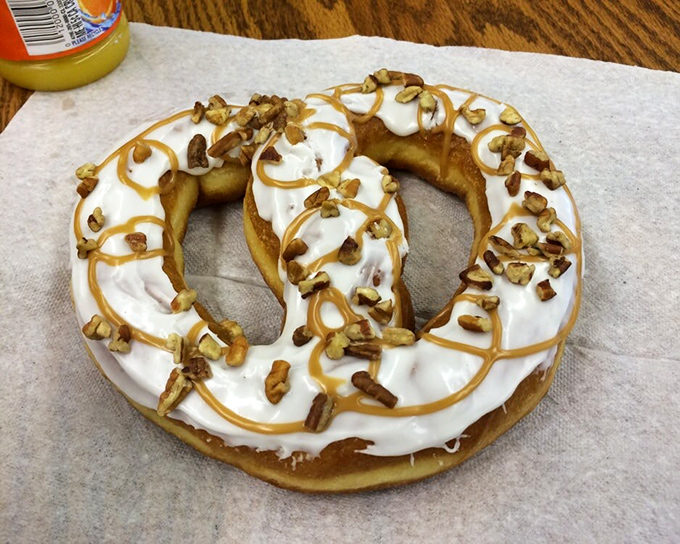 This isn't just a donut; it's a pretzel-shaped canvas for cream, caramel, and pecans&mdash;proof that thinking outside the circular box pays delicious dividends.