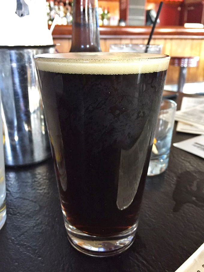 A perfectly poured craft beer with that ideal foam cap—the liquid equivalent of a standing ovation for your hot dog selection.