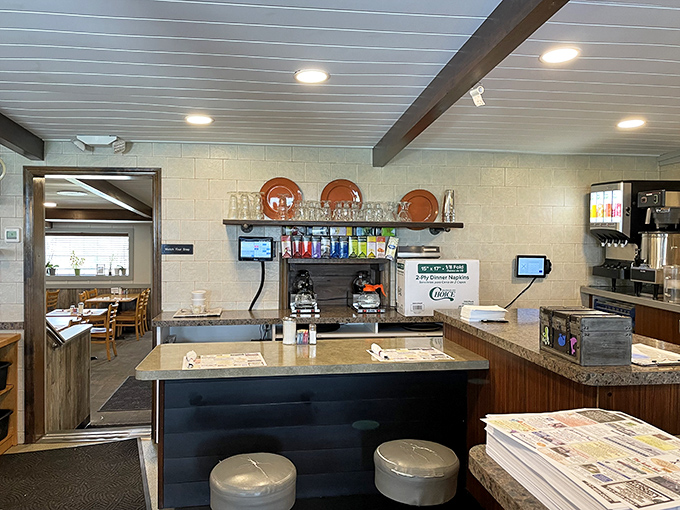 The counter where coffee dreams come true and servers orchestrate the morning rush with the precision of symphony conductors.