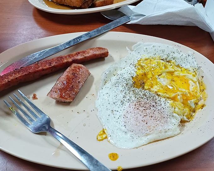 Eggs and smoked sausage living in perfect harmony, like a delicious breakfast peace treaty.
