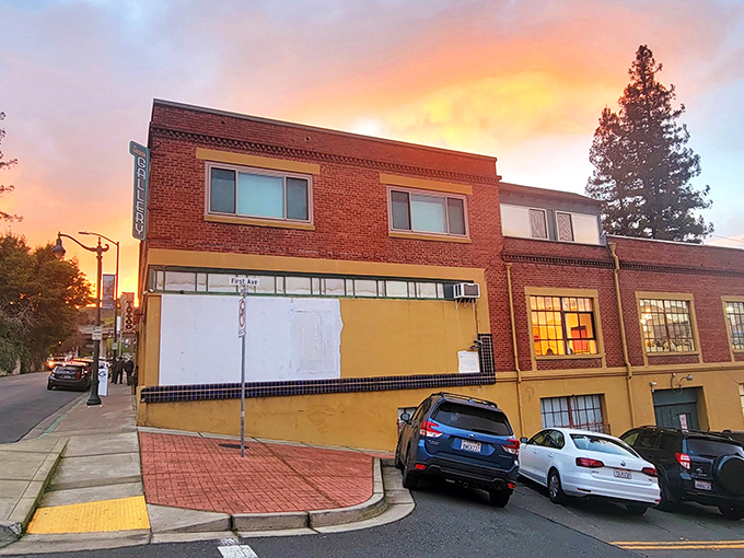Sunset bathes this brick building in golden light, transforming an ordinary street corner into a moment worthy of a California tourism brochure.