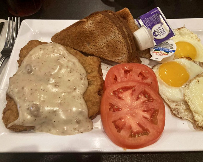 Country fried steak smothered in gravy alongside sunny eggs and toast&mdash;the breakfast equivalent of a warm hug from someone who loves you.