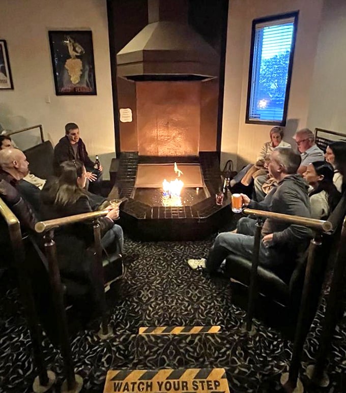 The fireplace lounge area offers intimate seating where friends gather to extend their evening over drinks and laughter.
