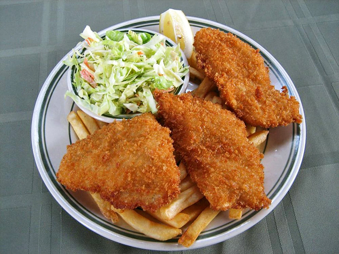 Fish and chips that deliver the perfect crunch-to-flake ratio. That coleslaw isn't just there for color—it's the refreshing counterpoint to fried perfection.