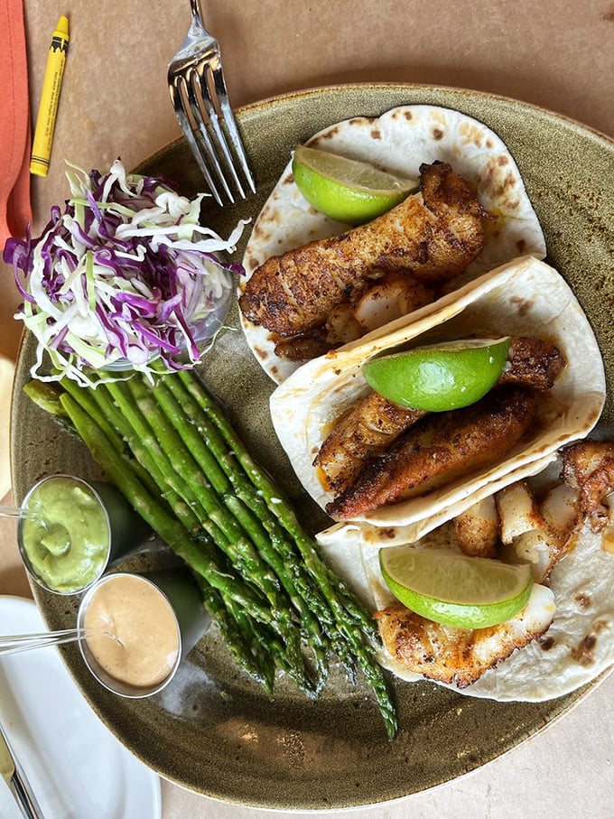 Fish tacos that make you question why you ever wasted time on lesser versions. The asparagus spears serve as elegant sentinels guarding flavor paradise.