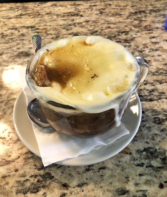 French onion soup that's wearing a hat of melted cheese. Comfort in a crock that makes you forget whatever was bothering you.