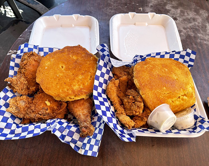 Two trays of fried chicken heaven with golden cornbread. This is the kind of meal that creates food memories that last a lifetime.