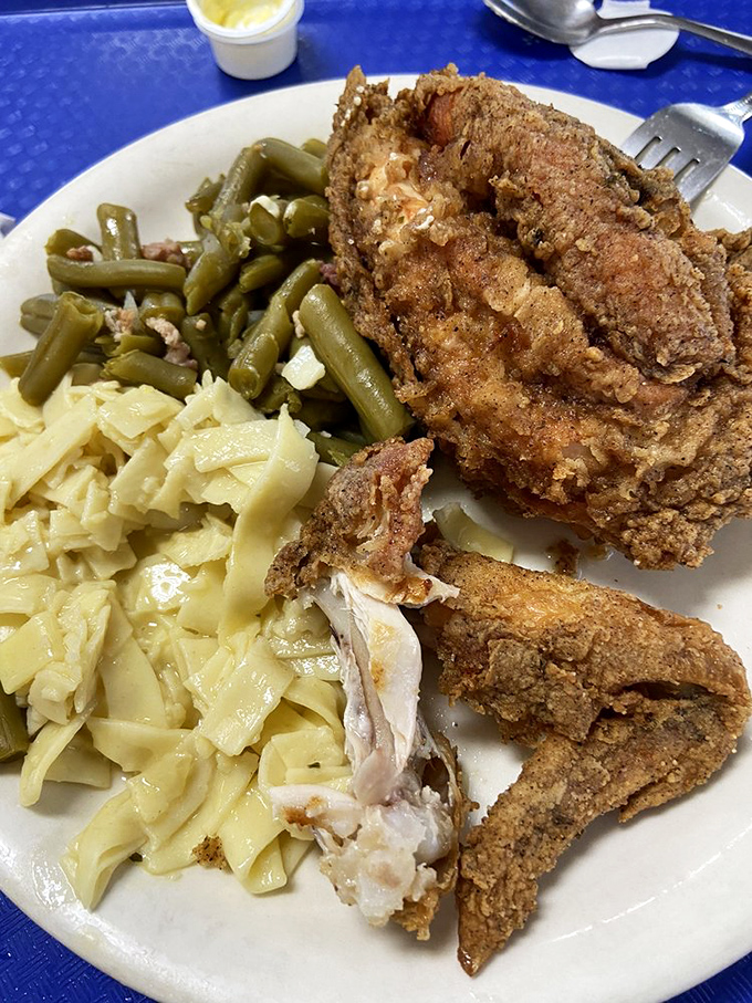 This isn't just fried chicken&mdash;it's edible nostalgia served with green beans and noodles that deserve their own fan club.