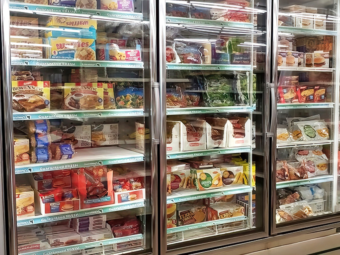 Frozen meals lined up like soldiers, ready for microwave duty. Bachelor survival kits at prices that won't freeze your budget.