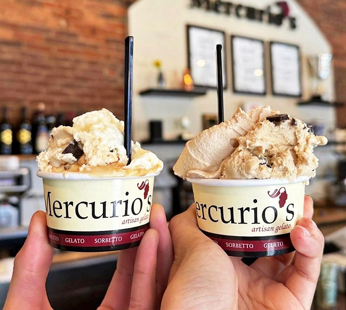 Two scoops of happiness in branded cups. This gelato doesn't just cool you down—it gives you that childlike grin that no adult ever truly outgrows.