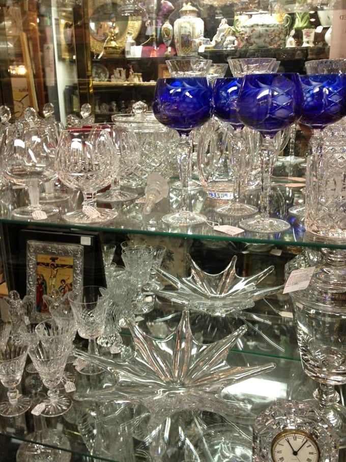 Cobalt blue stemware stands sentinel among crystal treasures—each glass waiting to elevate your next dinner party from ordinary to extraordinary.
