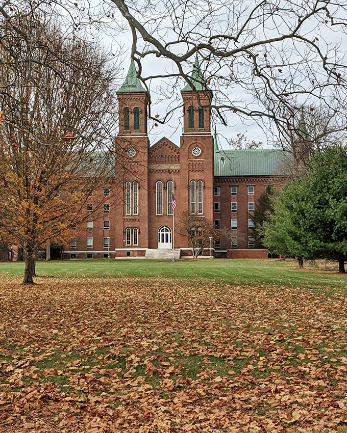 Antioch College's historic buildings stand as monuments to progressive education, surrounded by autumn leaves that seem to fall in reverent slow motion.