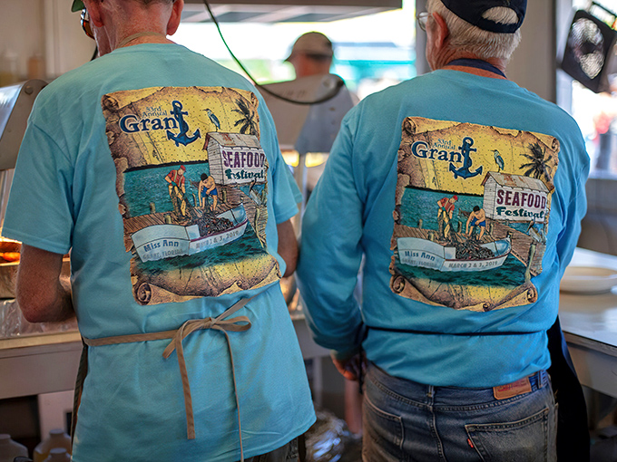 The Grant Seafood Festival volunteers sport their colors with pride. These aqua-shirted locals are the heart and soul of this beloved community tradition.