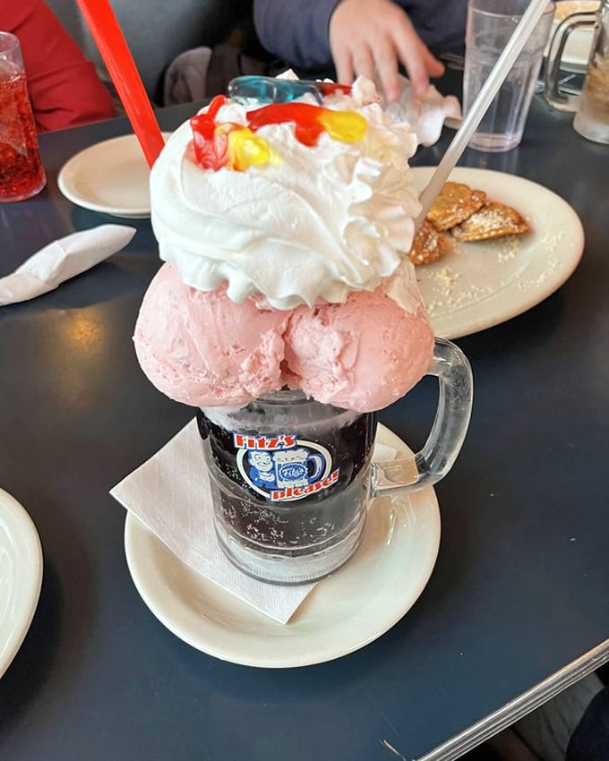 The Grape Escape float isn't just dessert, it's performance art&mdash;a tower of pink ice cream and whipped cream that demands to be photographed before devoured.