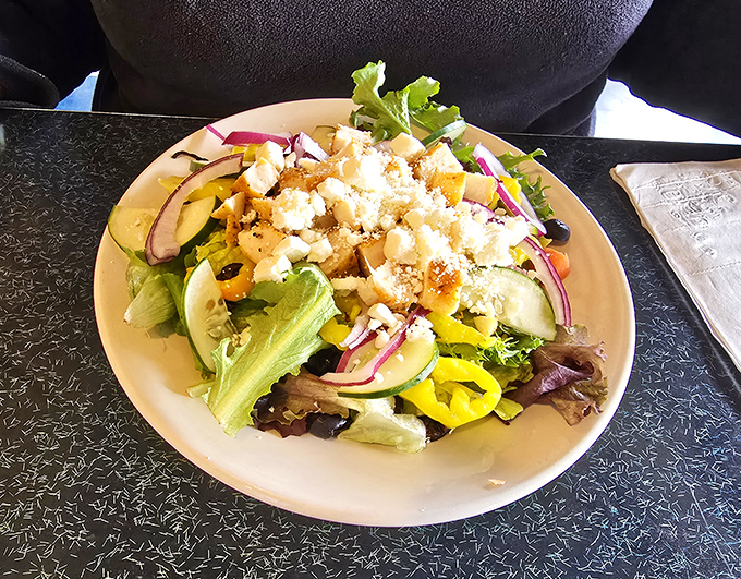 The Greek salad bursts with Mediterranean sunshine, bringing Athens directly to your Columbus table.