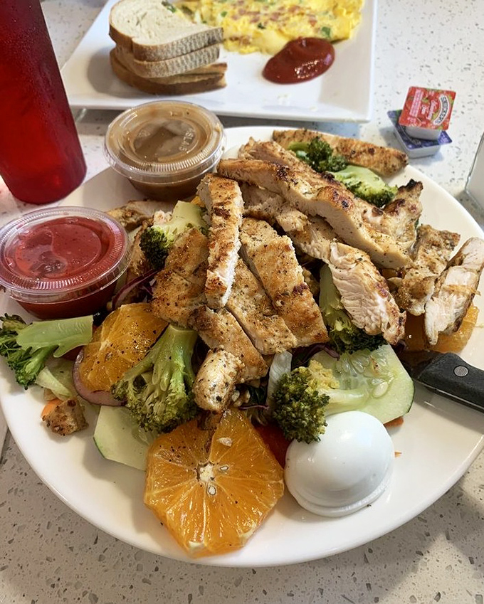 Hawaii called and sent its regards. Grilled chicken mingles with citrus and greens in this vacation-on-a-plate that brightens any Delaware day.