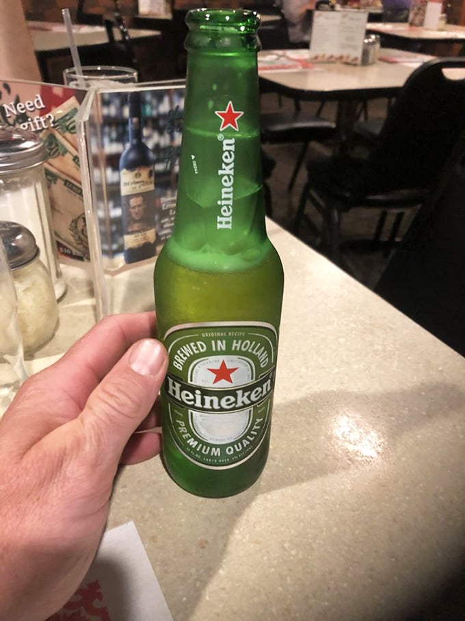 A cold Heineken awaits its destiny&mdash;to wash down pizza that deserves a proper beverage companion. Some matches are just meant to be.