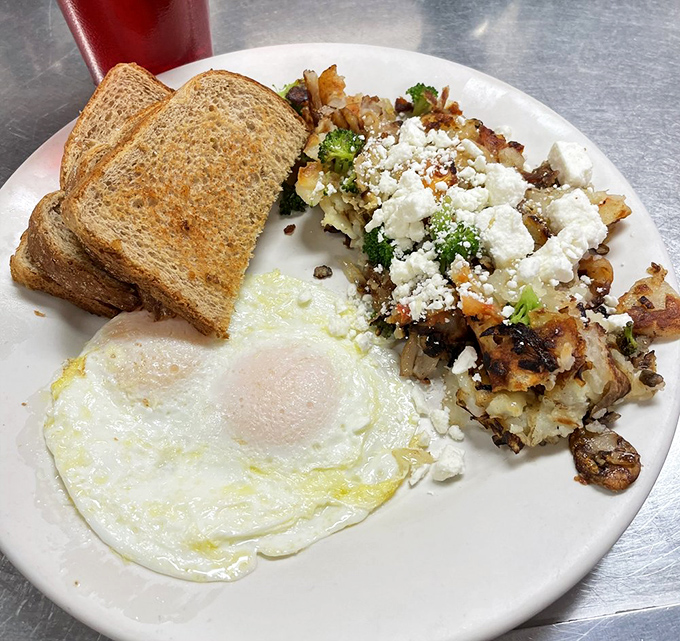 The "Hippie Hash" brings peace, love and feta cheese to your morning. A perfectly fried egg stands guard over this vegetable-packed masterpiece.
