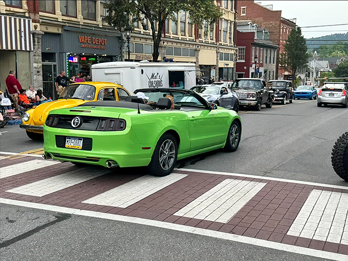 Classic cars parade through downtown during Bellefonte's historic cruise events. That lime green Mustang is having more fun than most people.