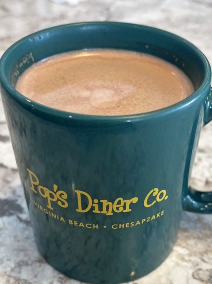 That steaming mug of coffee promises to transform you from zombie to human. The teal cup adds a splash of diner charm.