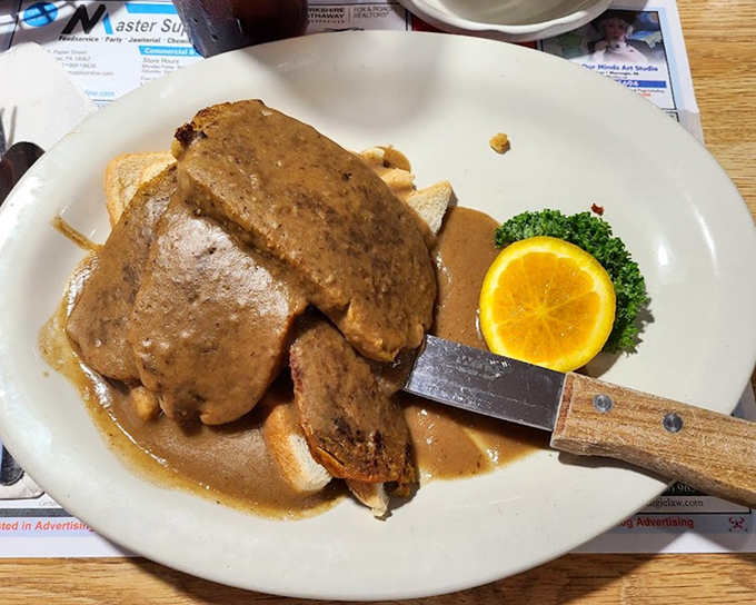 When a hot meatloaf sandwich arrives looking like this, you know you've found a place that understands the architecture of comfort food.