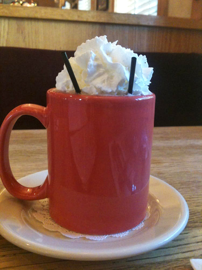 Hot chocolate that doesn't just come with whipped cream&mdash;it comes with a whipped cream skyscraper. Sipping optional, face-planting inevitable.