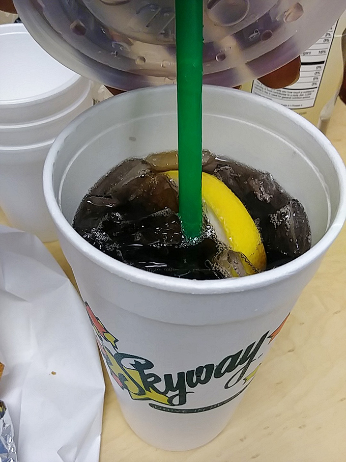 The perfect companion to any burger feast &ndash; a Skyway sweet tea with lemon, where the condensation on the cup is practically Midwestern poetry.