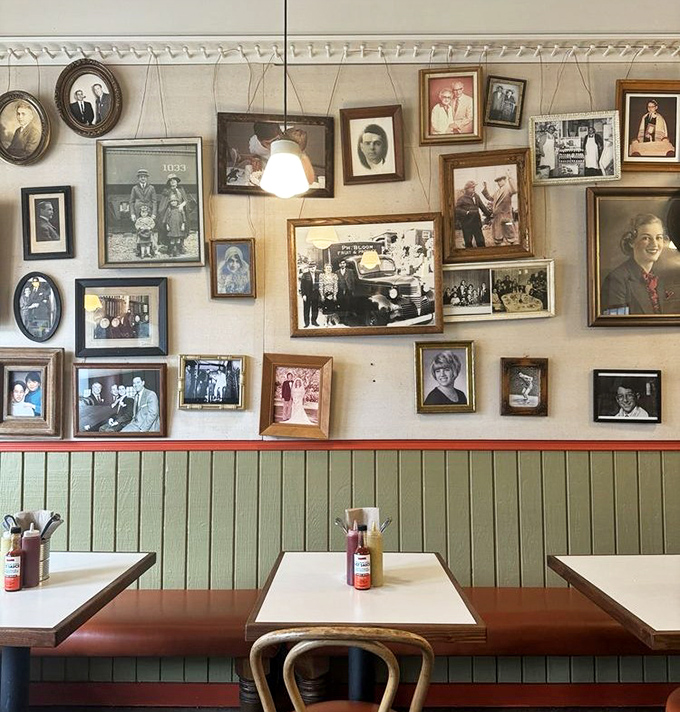 The photo wall tells stories spanning generations. Each frame holds memories of people who probably knew their way around a brisket.