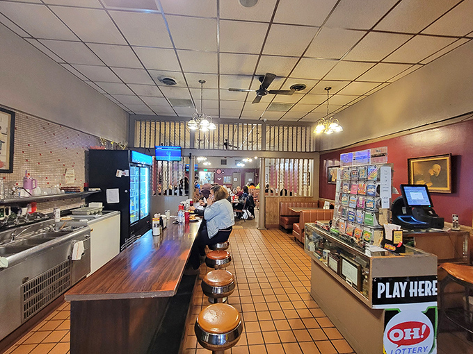 The counter view reveals the diner's soul—where orders are called, regulars are greeted by name, and the coffee is always fresh.