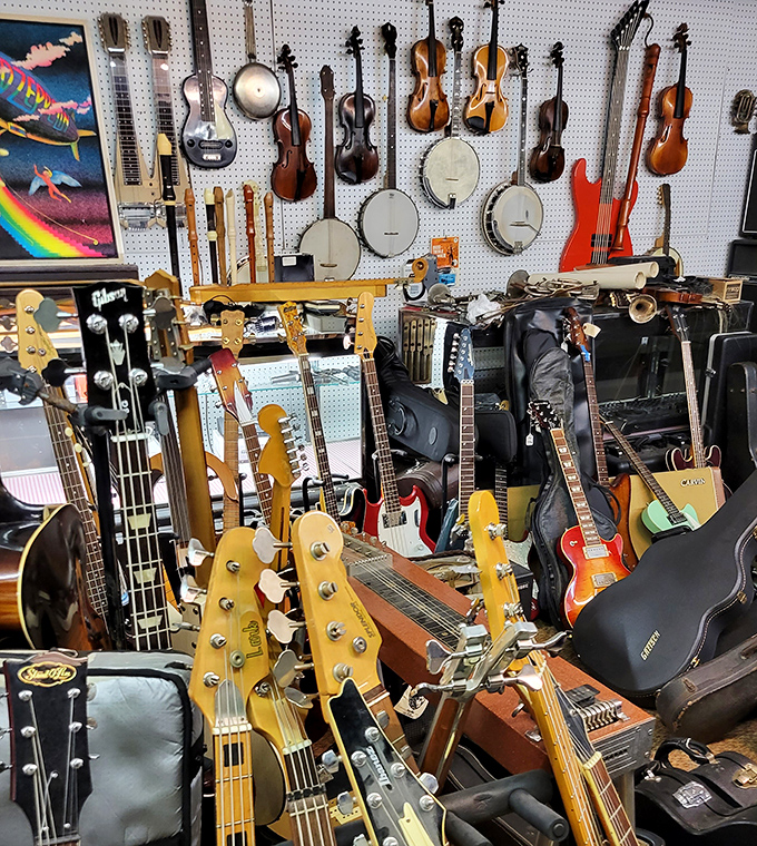 The wall of sound history&mdash;where vintage guitars and banjos hang like trophies, each with stories of campfires, heartbreaks, and honky-tonks.