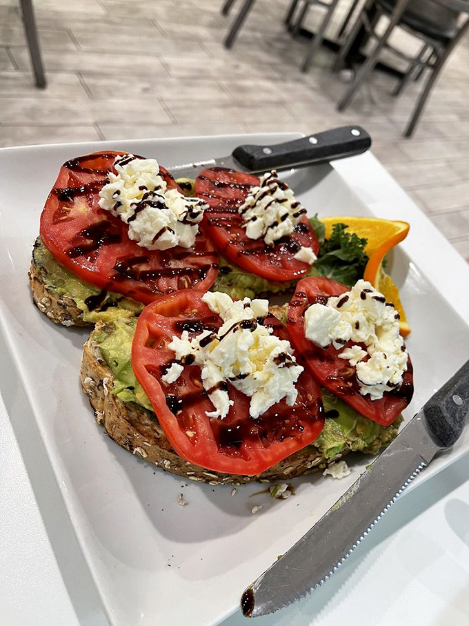 Avocado toast gets the Grampa's treatment: fresh tomatoes, feta, and a balsamic drizzle that makes "trendy" and "traditional" shake hands and become friends.