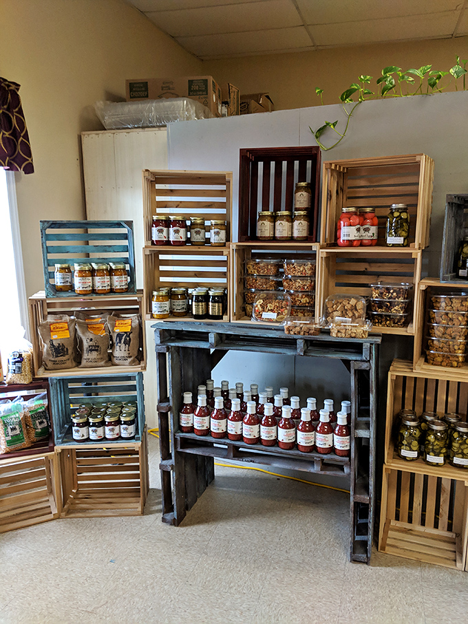 Wooden crates showcase preserves and pickles that capture seasons in jars. Grandma's recipes meet modern cravings in this corner of preserved perfection.