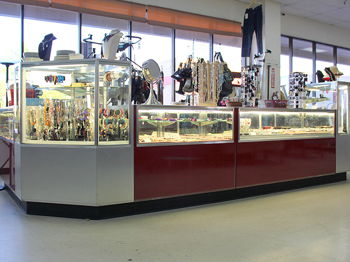 The jewelry counter gleams with possibility. Behind glass, forgotten treasures wait for someone who appreciates vintage sparkle more than brand-new price tags.