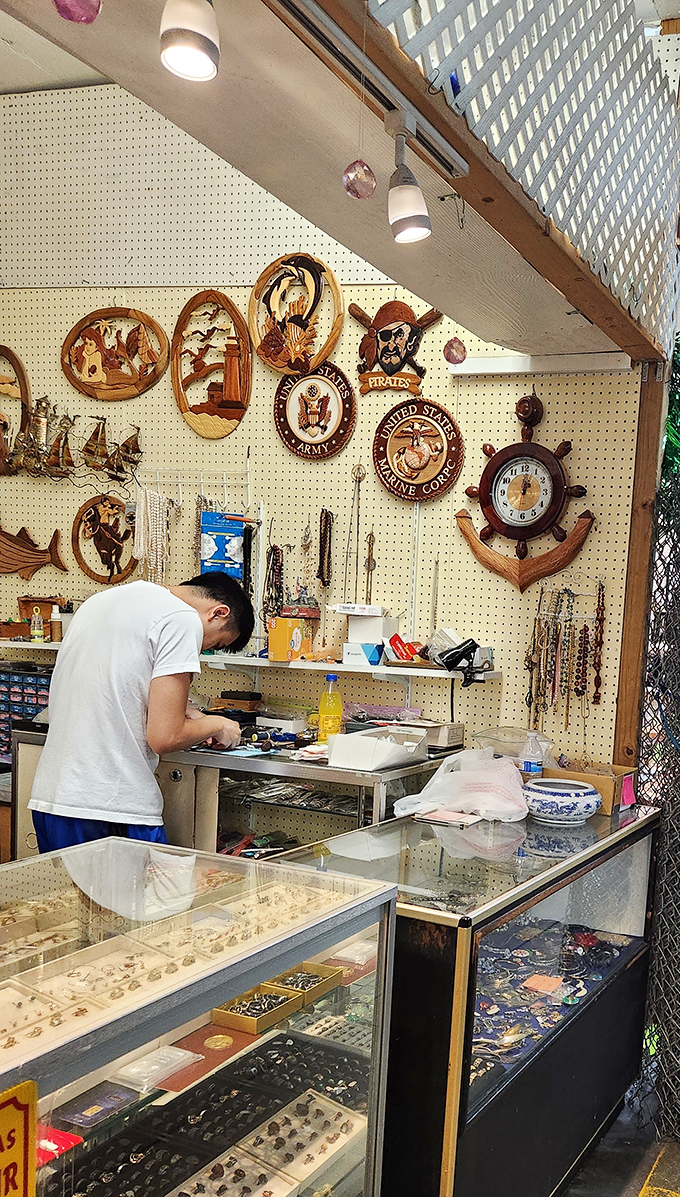 Craftsmanship in action at this jewelry repair booth. Where family heirlooms get new life and impulse purchases get properly sized.