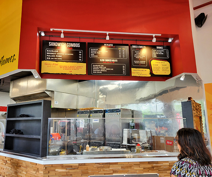 Open kitchen concept lets you witness the beautiful choreography of barbecue masters at their craft.