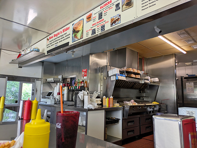 The kitchen reveals the organized chaos where burger magic happens. Nothing fancy, just well-worn equipment that knows its job perfectly.