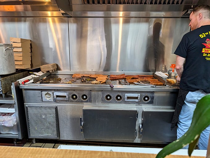 The flat-top grill&mdash;hallowed ground where hot dog magic happens. Some might call it cooking; I call it performance art.