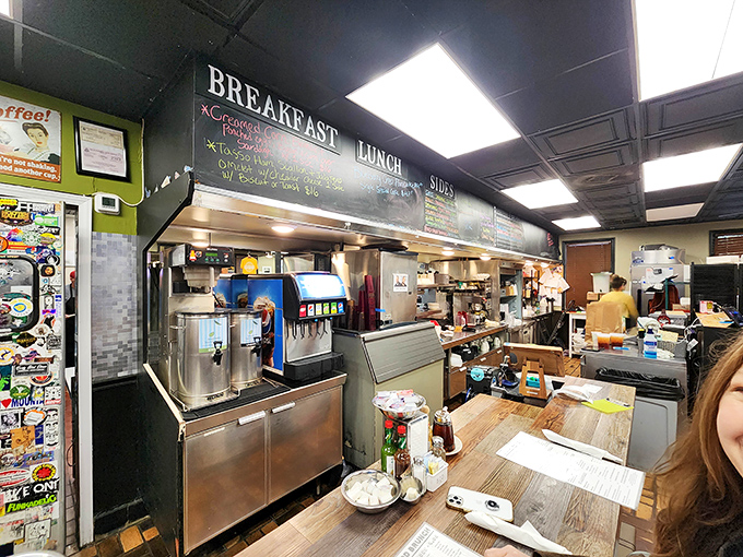 The heart of the operation where breakfast dreams come true. Those chalkboard menus hint at specials worth abandoning your diet for.