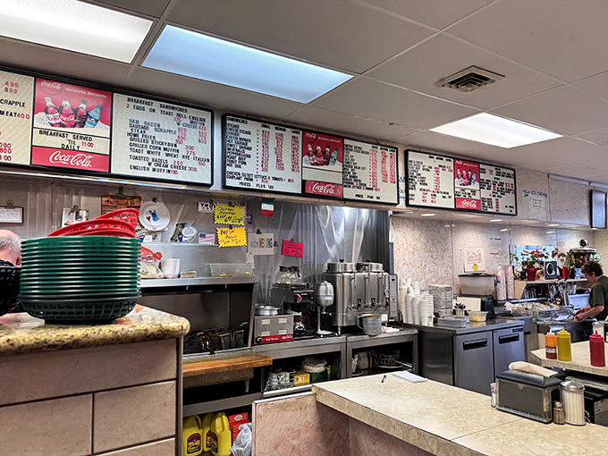 The kitchen at Lou's&mdash;where sandwich magic happens daily. No smoke and mirrors, just honest cooking in plain view.