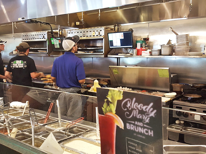 The open kitchen&mdash;where breakfast dreams come true and Bloody Marys are born. These culinary wizards don't need curtains to hide their magic.