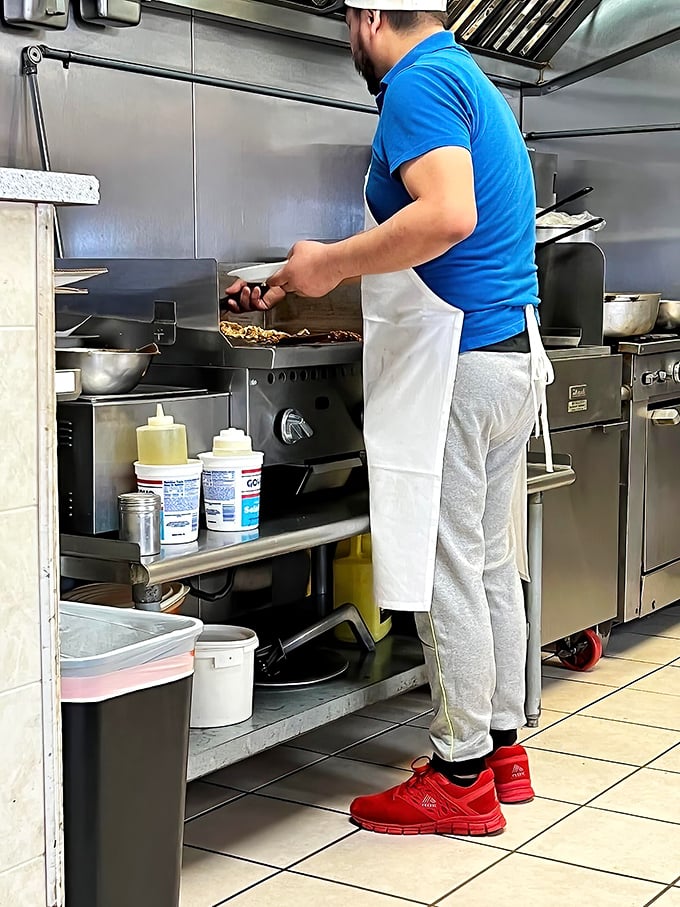 Where the magic happens. No fancy equipment, just skilled hands creating dishes that speak directly to your soul.