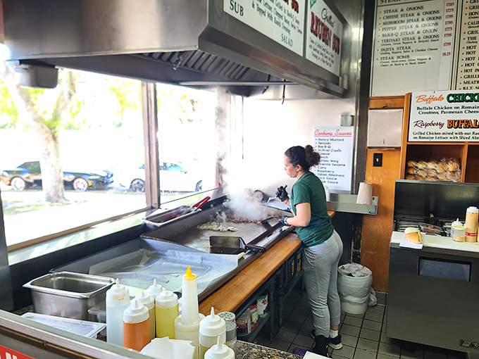 Where the magic happens &ndash; steam rising from the grill as another sandwich masterpiece takes form. The kitchen ballet is mesmerizing.