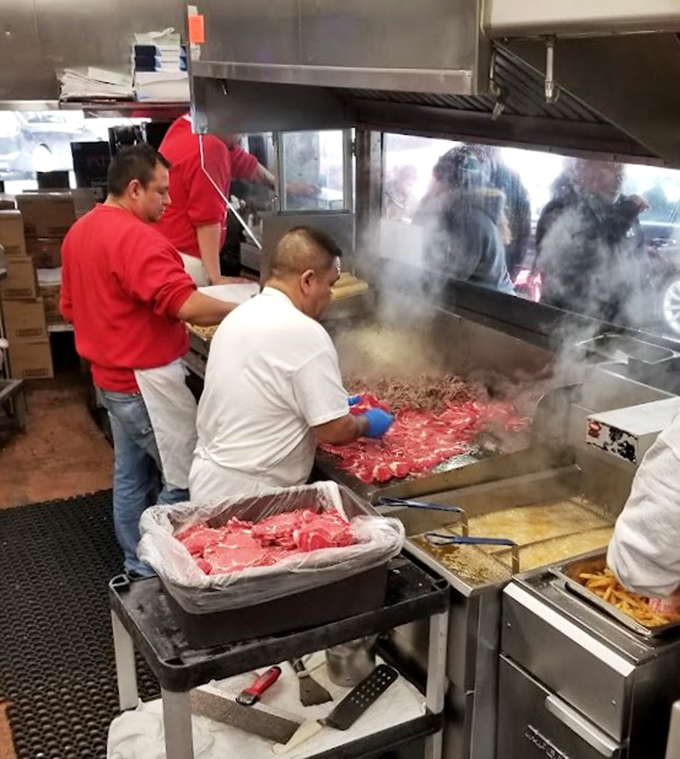 The grill masters at work! Like watching Picasso paint, if Picasso worked with thinly sliced ribeye and a very hot surface.