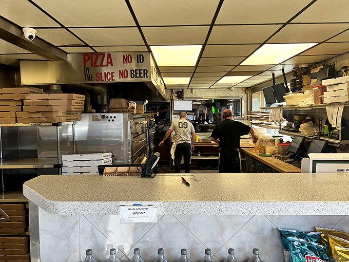 Behind-the-scenes pizza magic! Where "No ID, No Slice, No Beer" isn't just a sign&mdash;it's a philosophy of life.