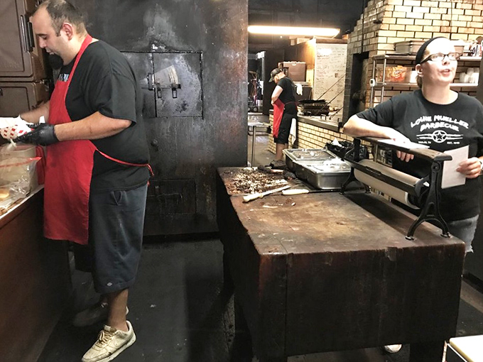 The kitchen &ndash; where smoke and time transform ordinary meat into extraordinary memories. Those cutting boards have stories to tell.