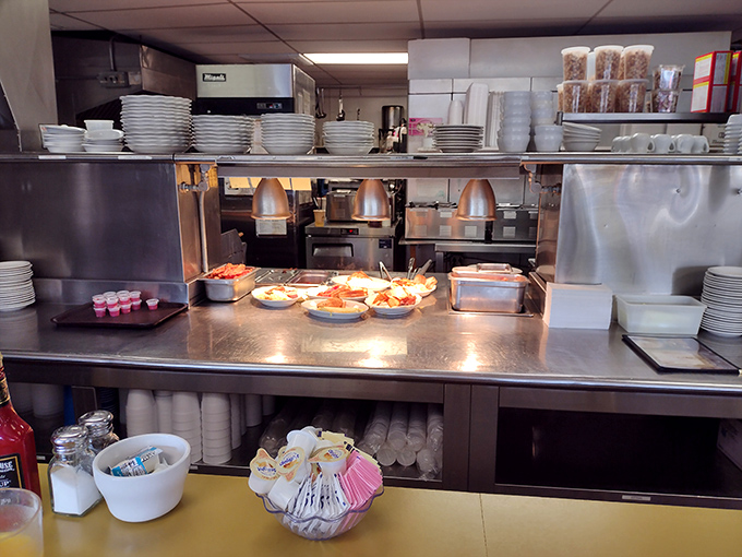 The pass where magic happens. Those heat lamps aren't just keeping food warm&mdash;they're spotlighting the stars of the show.