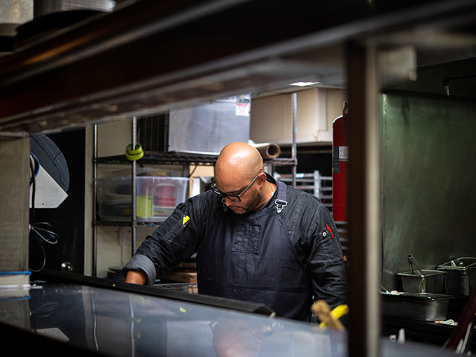 Where the magic happens &ndash; a glimpse into the kitchen where chefs transform ingredients into edible art with the focus of symphony conductors.