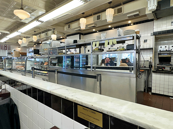 Behind that counter, sandwich artists practice their craft with the precision of Swiss watchmakers on deadline.